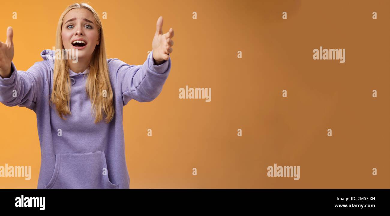 Excited fascinated glad blond woman adore singer performing stage ...