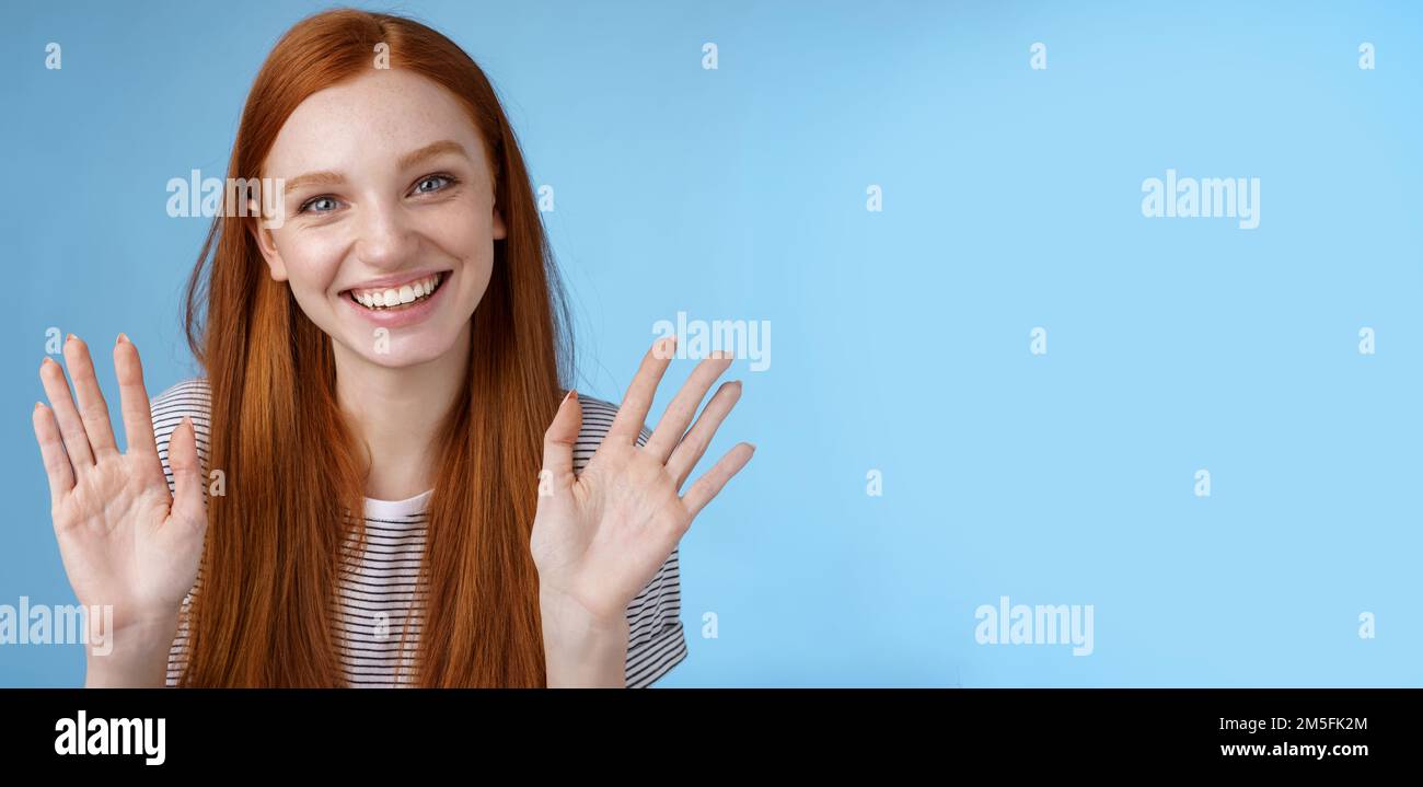 Charming redhead elder sister say goodbye sibling friends smiling ...