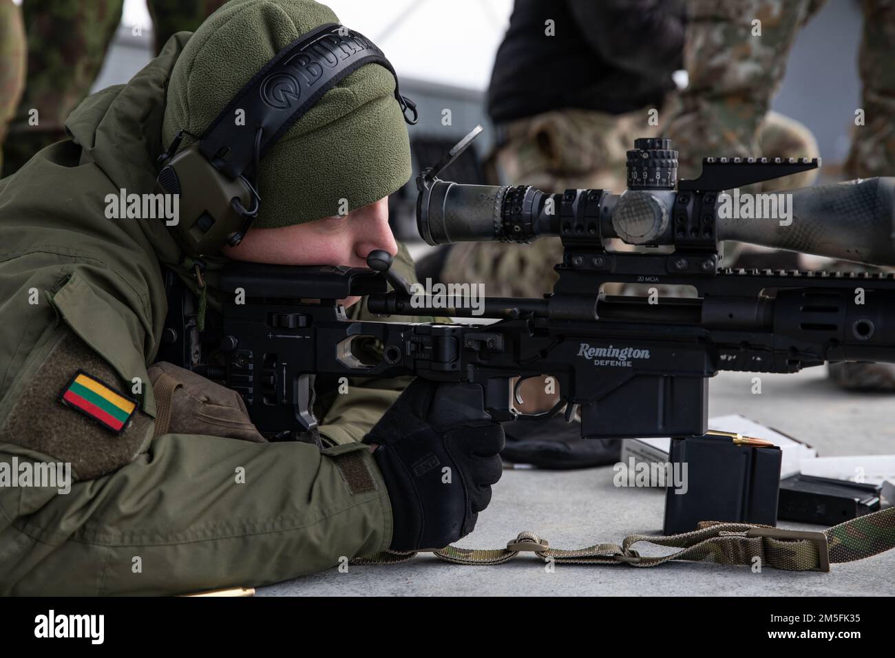 A Lithuanian National Defence Volunteer Forces (KASP) member sights a ...