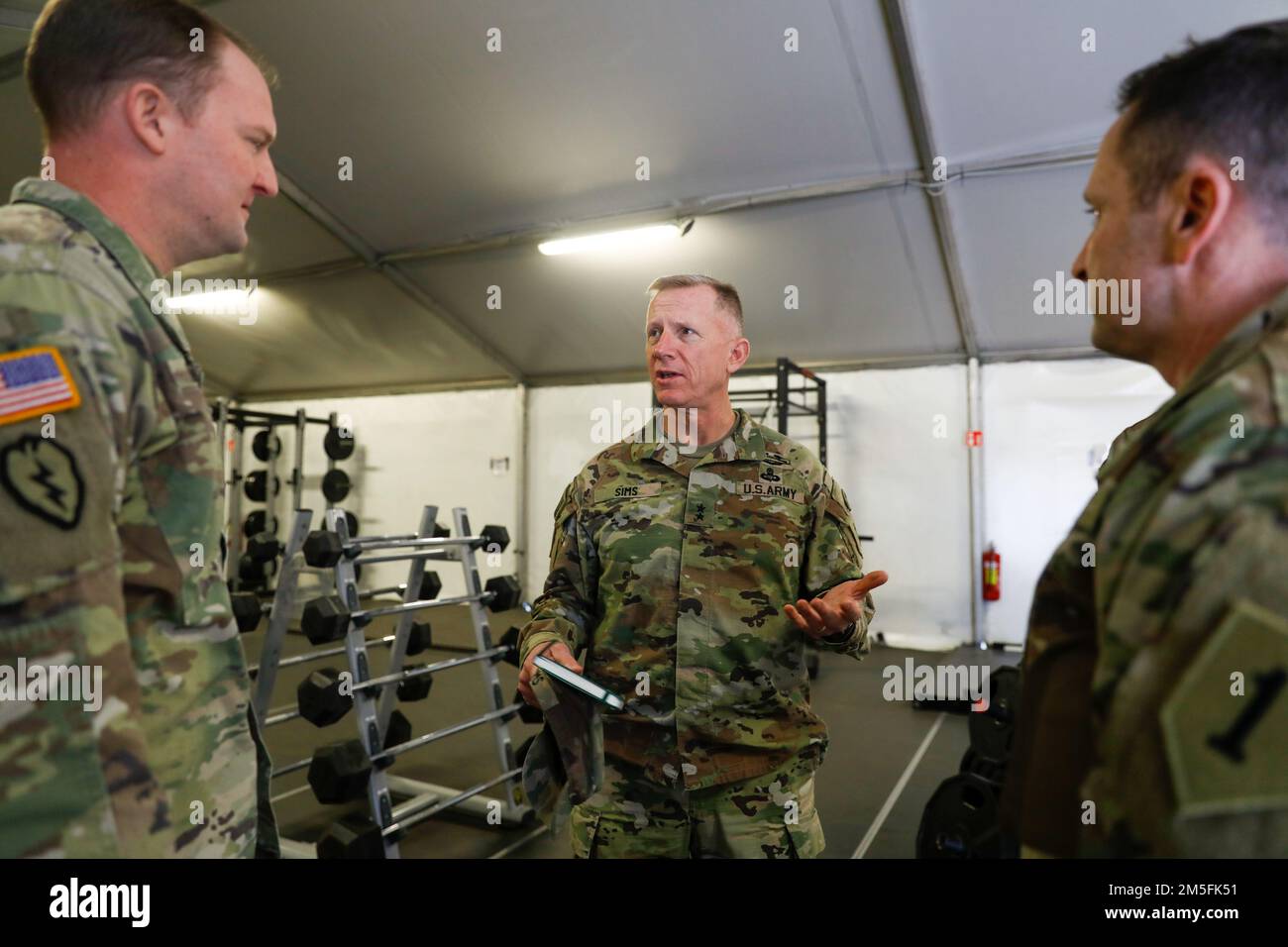 U.S. Army Maj. Gen. Douglas Sims, commanding general of the 1st Infantry Division speaks with U ...