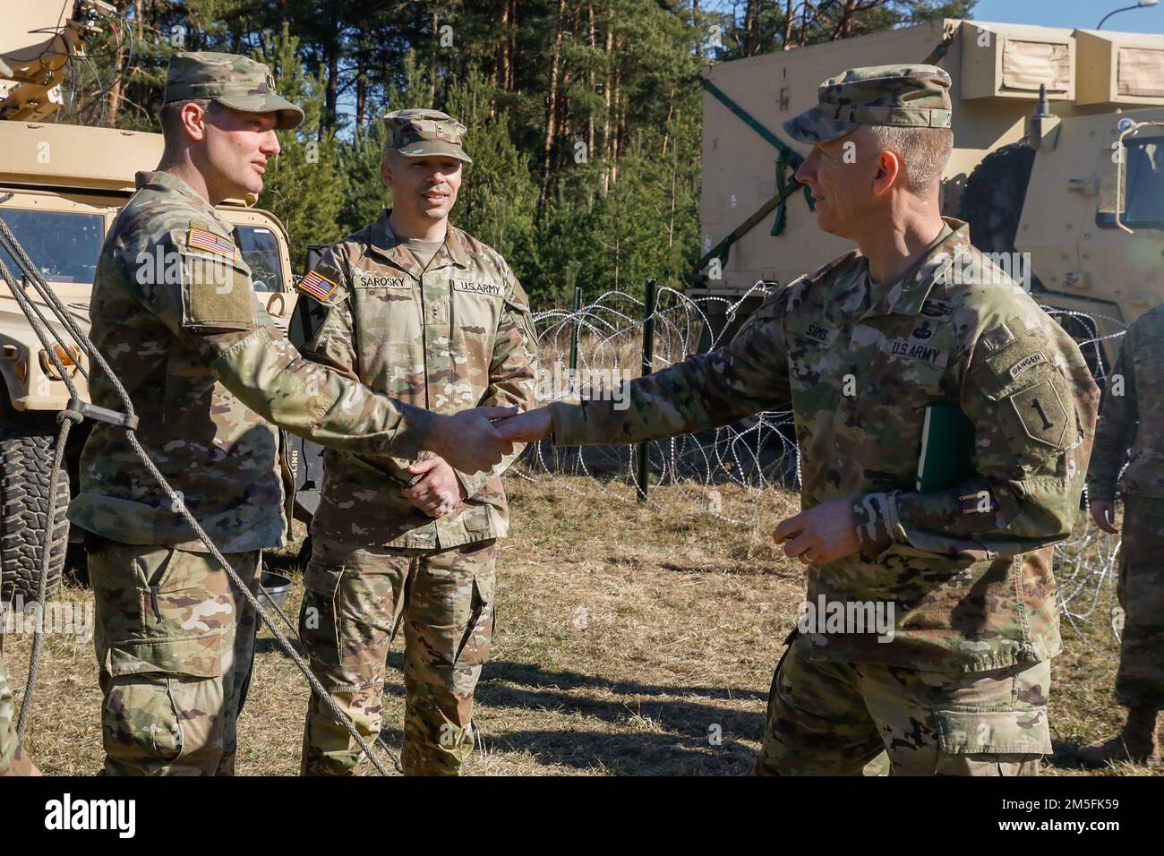 U.S. Army Maj. Gen. Douglas Sims, right, commanding general of the 1st ...