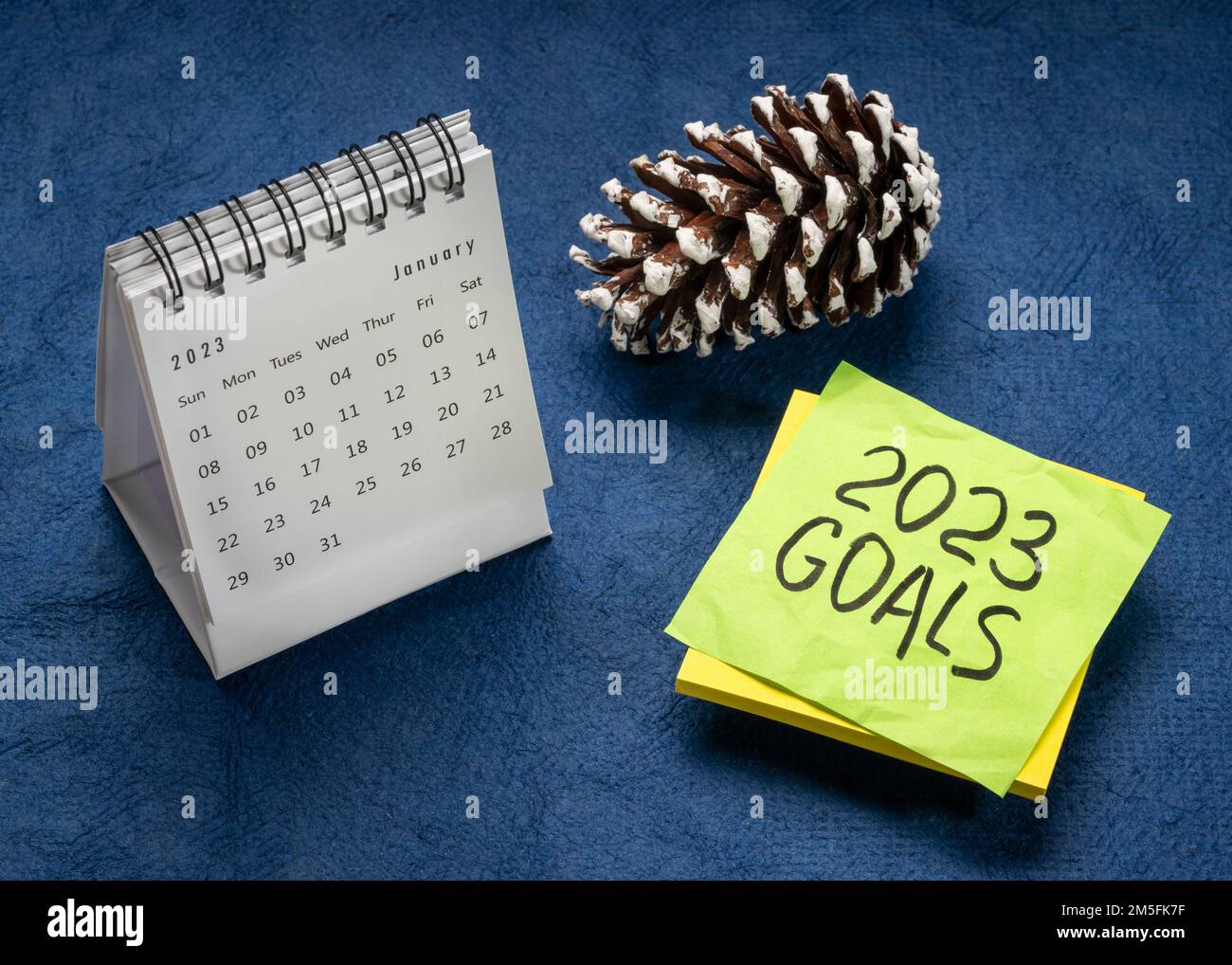 2023 goals - handwriting in black ink on a reminder note with a January ...