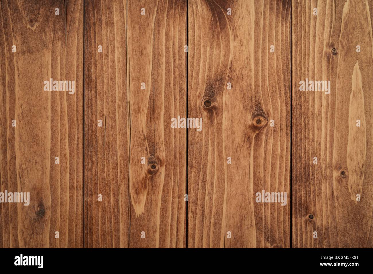 background and texture of stained wooden board with numerous knots ...