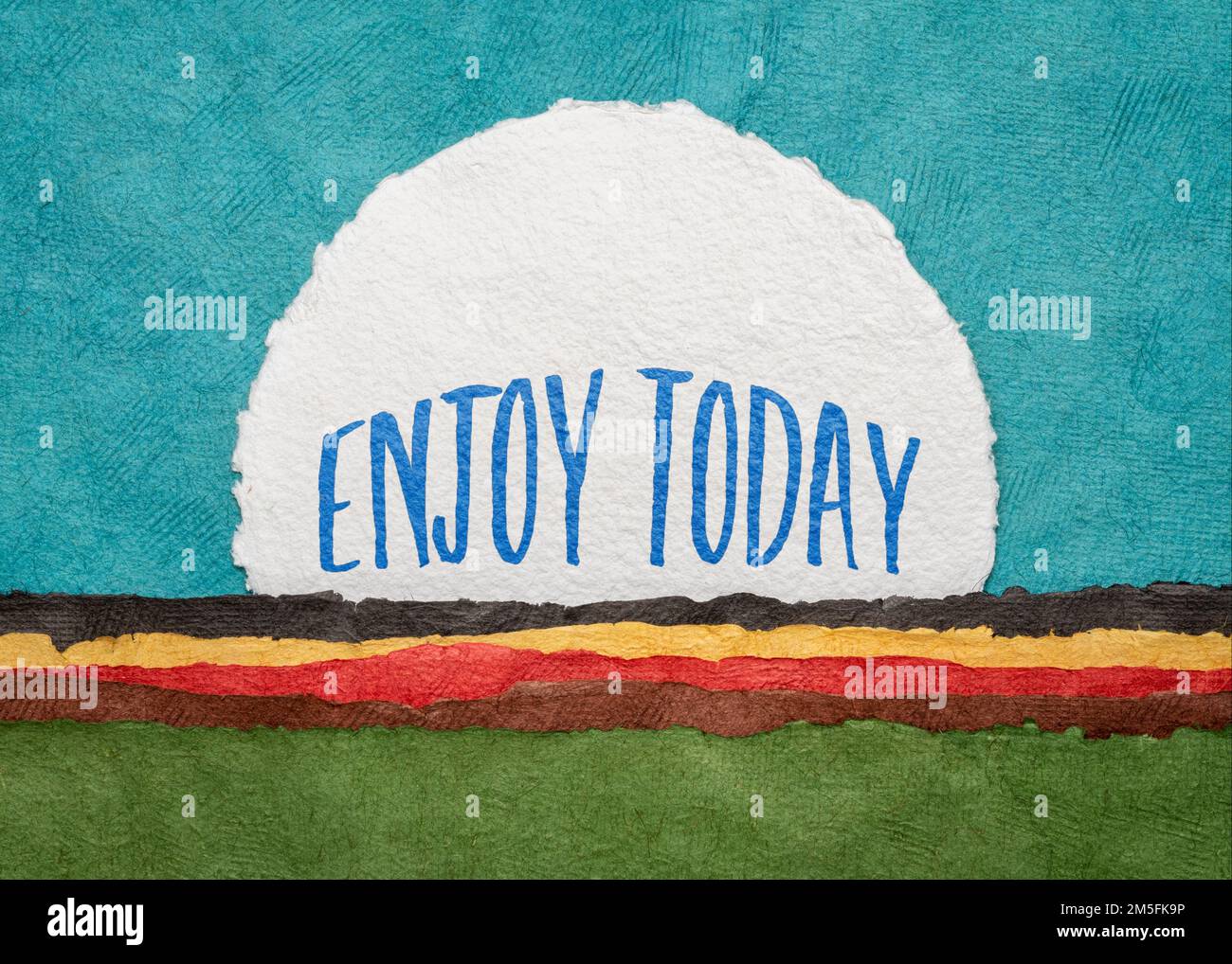 Enjoy today reminder - handwriting against abstract paper landscape ...