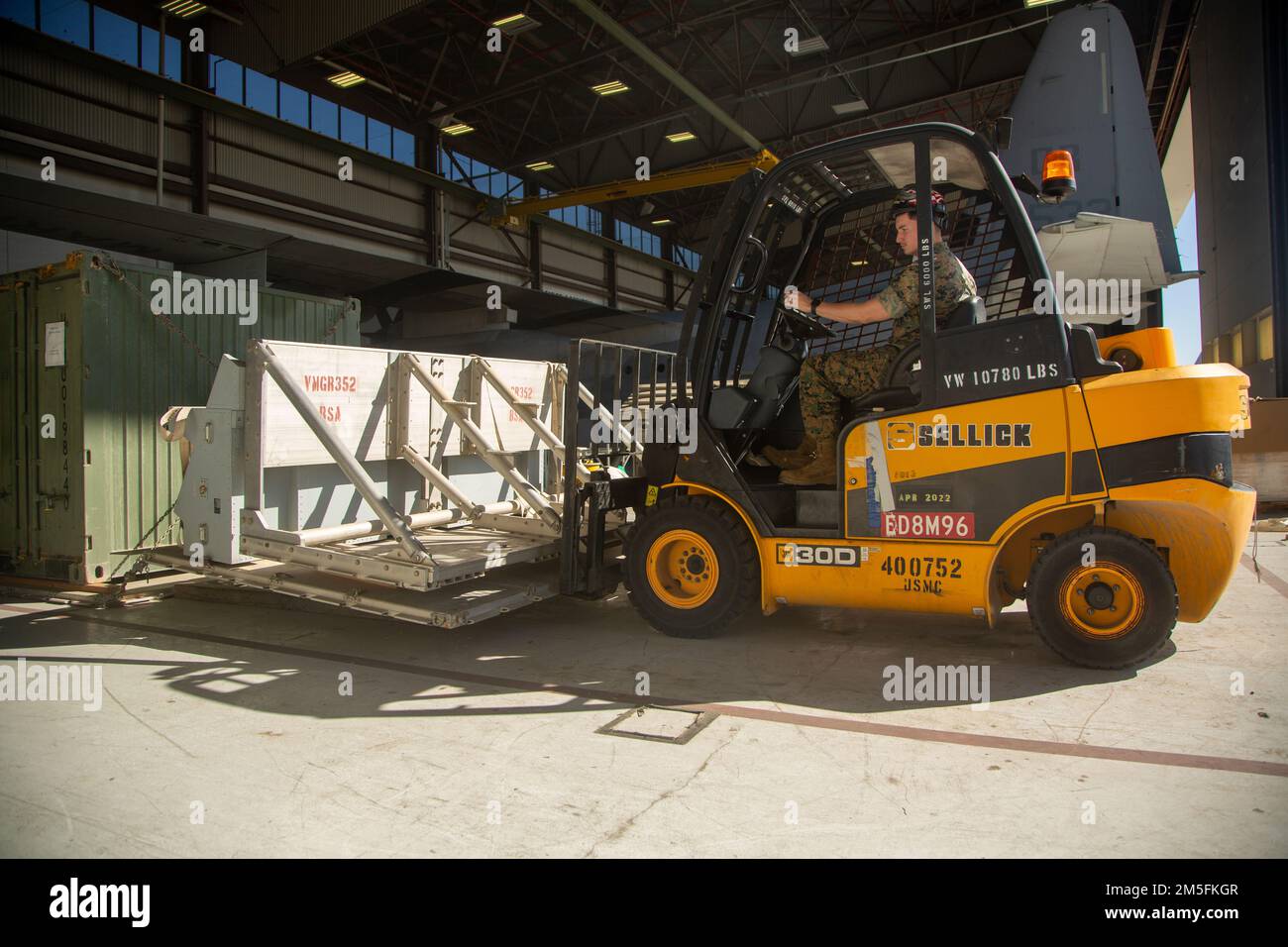 A U.S. Marine with Marine Aerial Refueler Transport Squadron 352 ...
