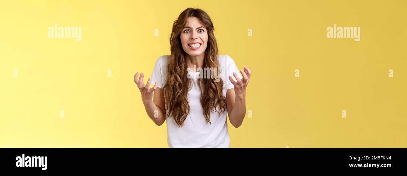 Annoyed curly-haired caucasian irritated distressed girl cringe ...