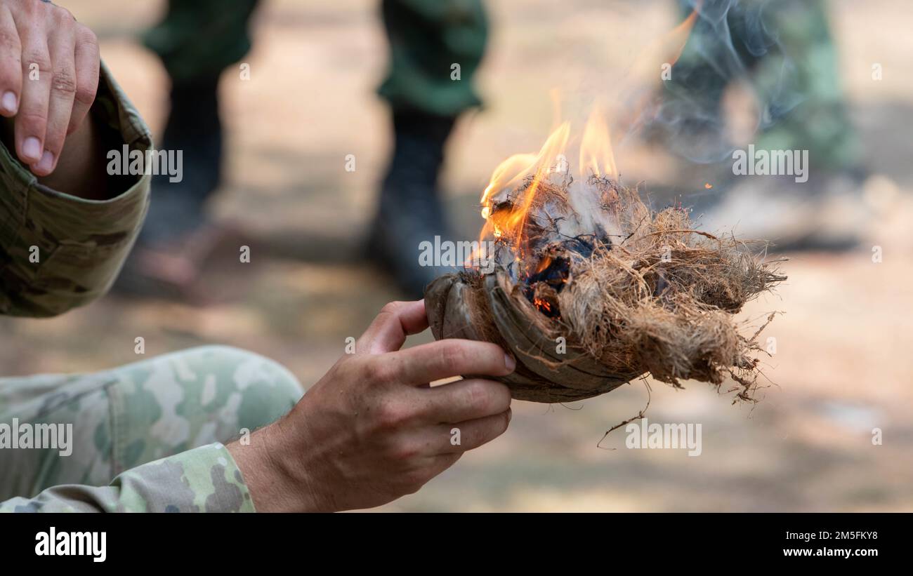 Flames ignite from coconut husk shavings 1st Lt. Angus Paradice, Alpha ...