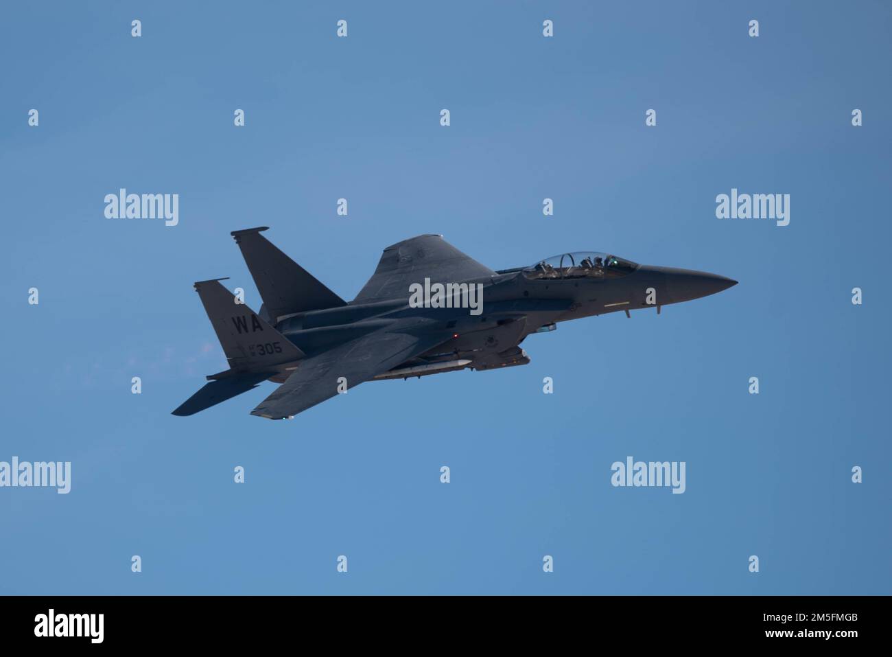 A U.S. Air Force F-22 Raptor performs aerial acrobatics in the skies ...