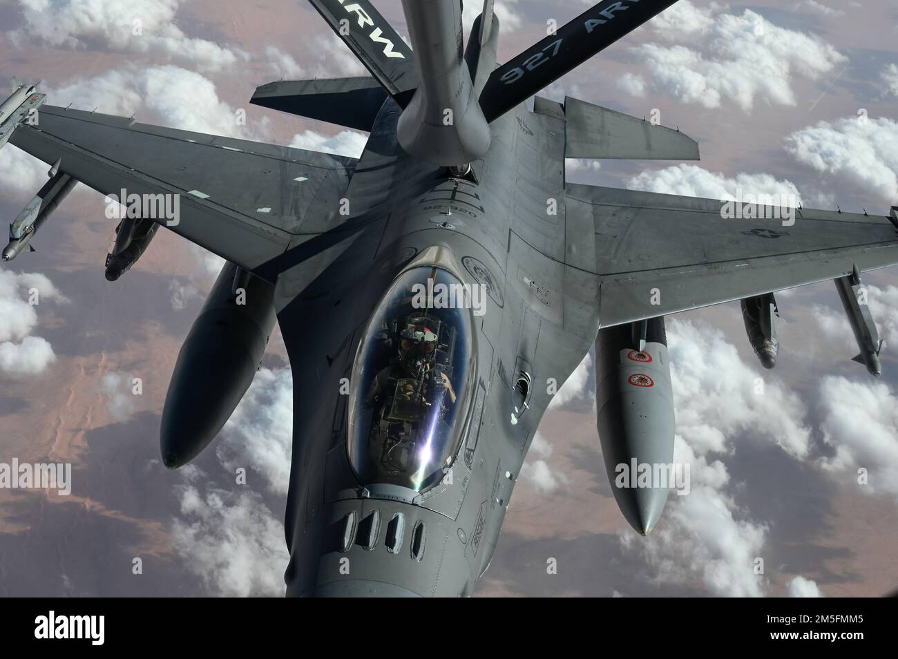 An F-16 Fighting Falcon pilot assigned to the 77th Expeditionary ...