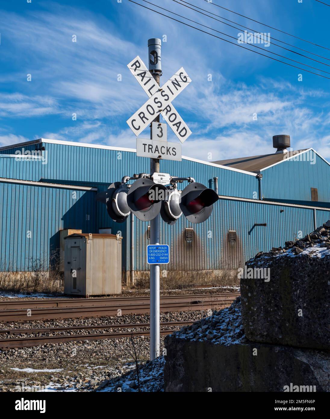 A railroad crossing sign on CSX tracks in Braddock, Pennsylvania, USA ...