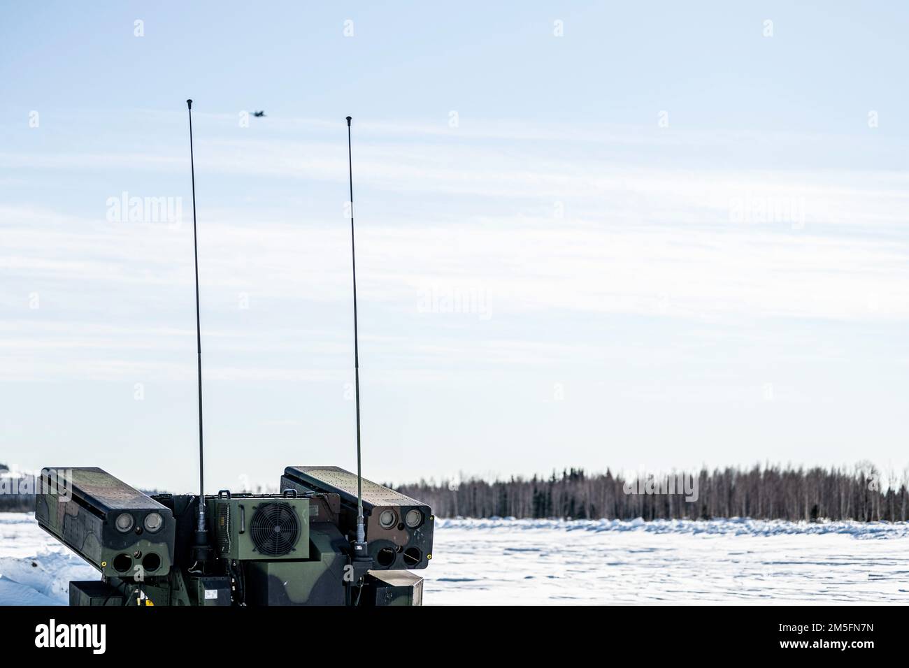 An Avenger air defense system turret tracks an F-16 in flight during ...