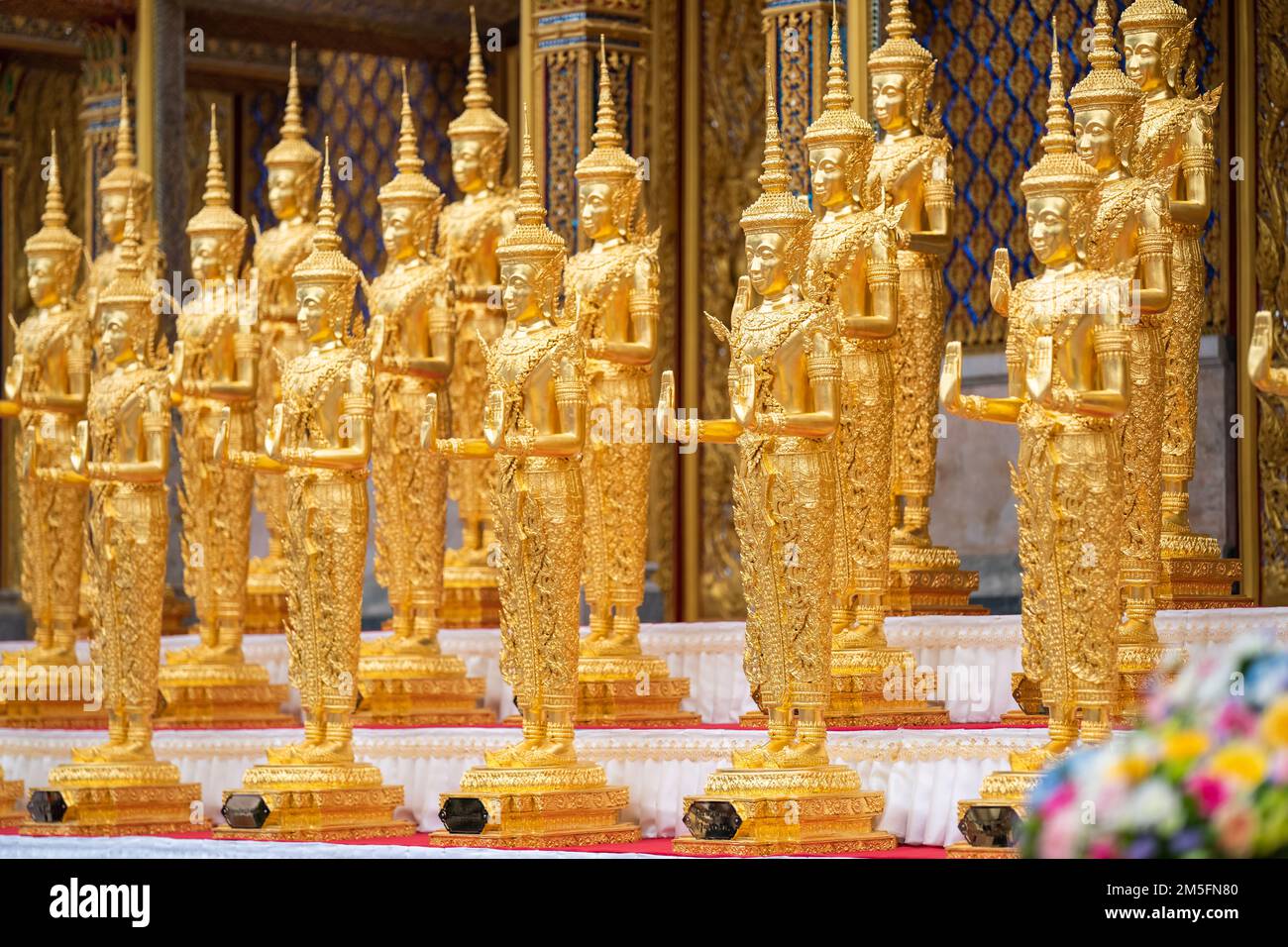 A Lot of Golden Statue standing in the temple Stock Photo - Alamy