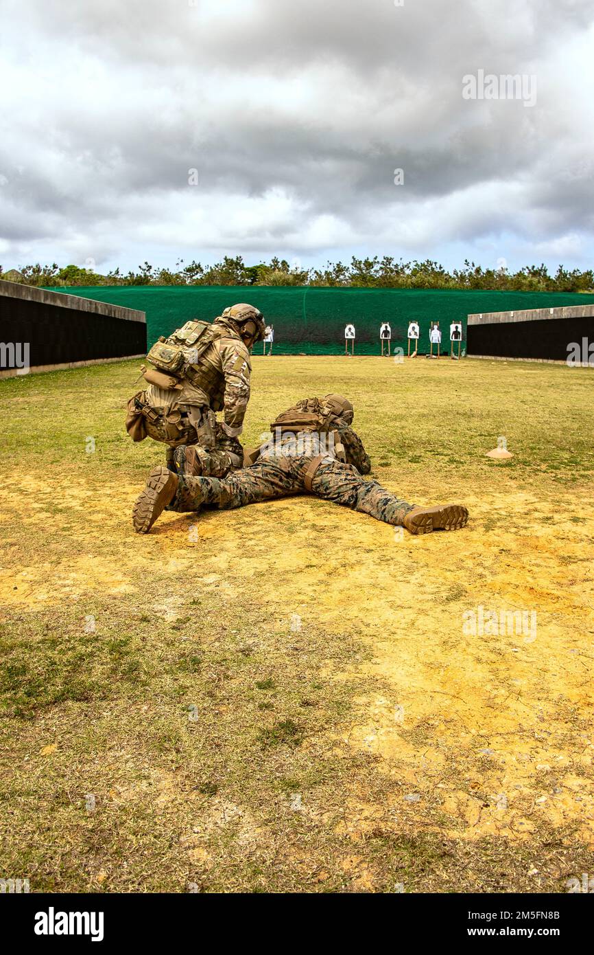 A reconnaissance Marine with III Marine Expeditionary Force, fires ...