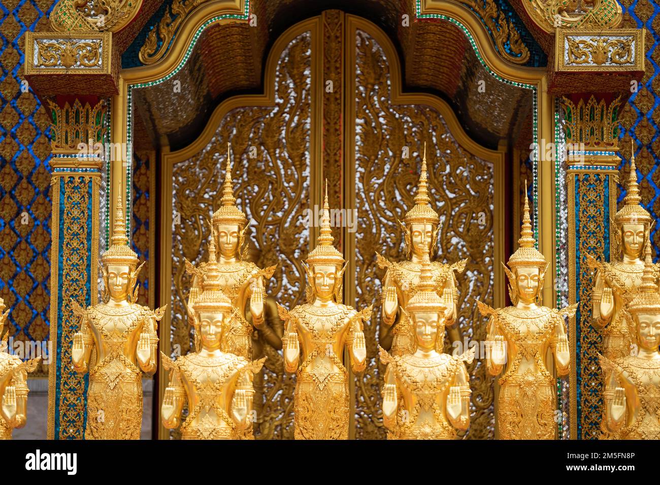 A Lot of Golden Statue standing in the temple Stock Photo - Alamy