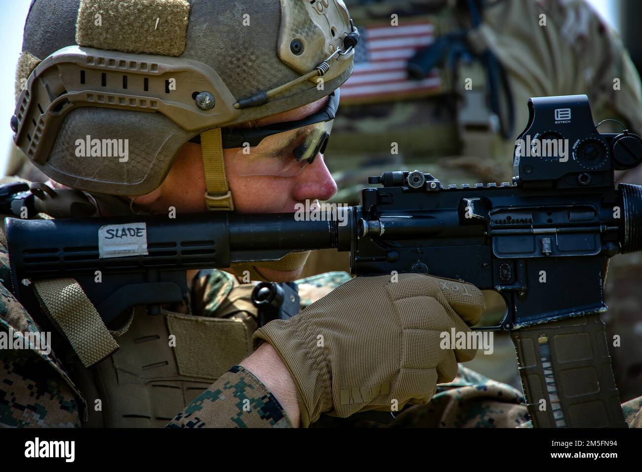 U.S. Marine Corps Cpl. James Greenslade, a radio operator with 3rd ...