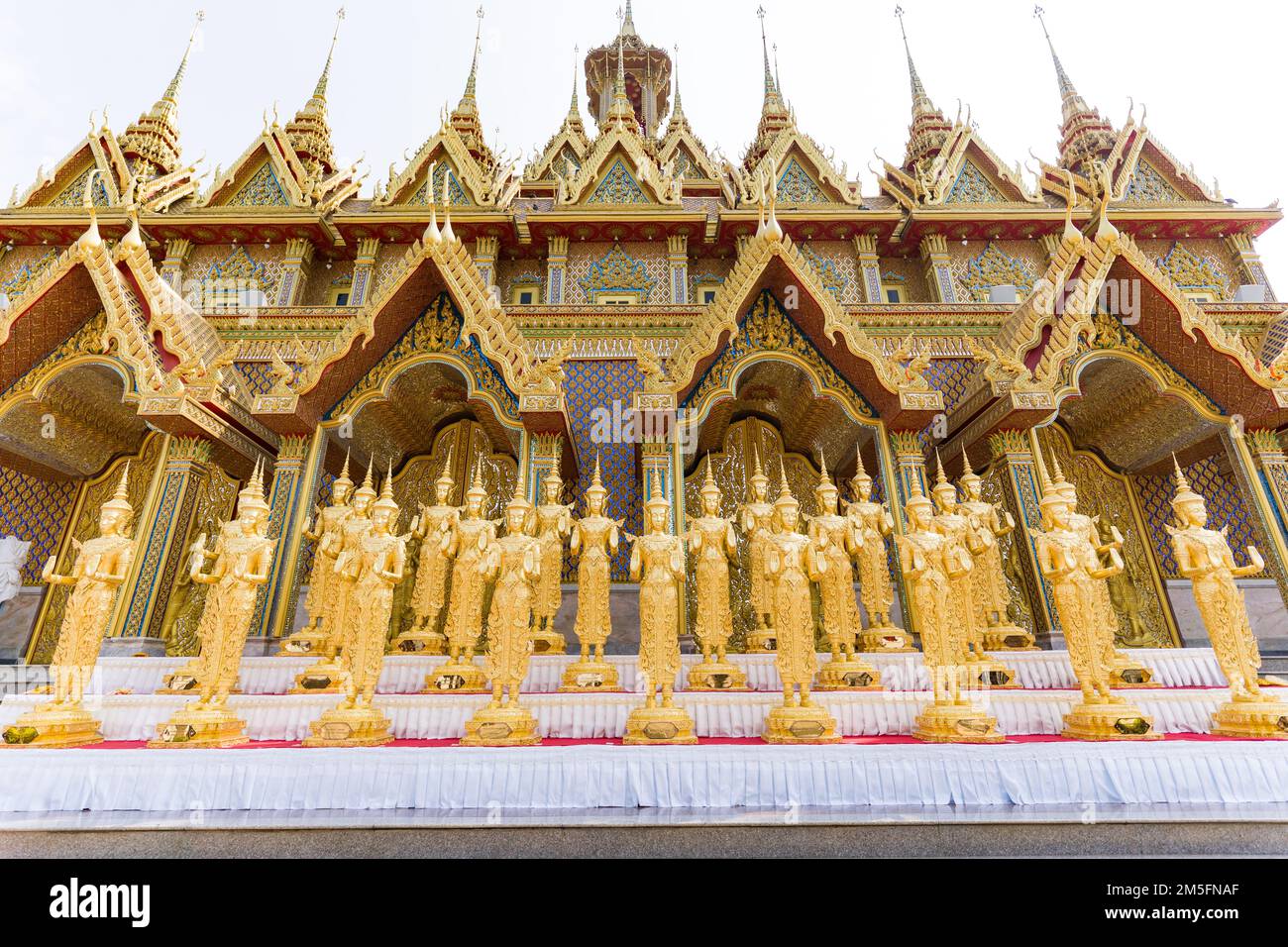 A Lot of Golden Statue standing in the temple Stock Photo - Alamy