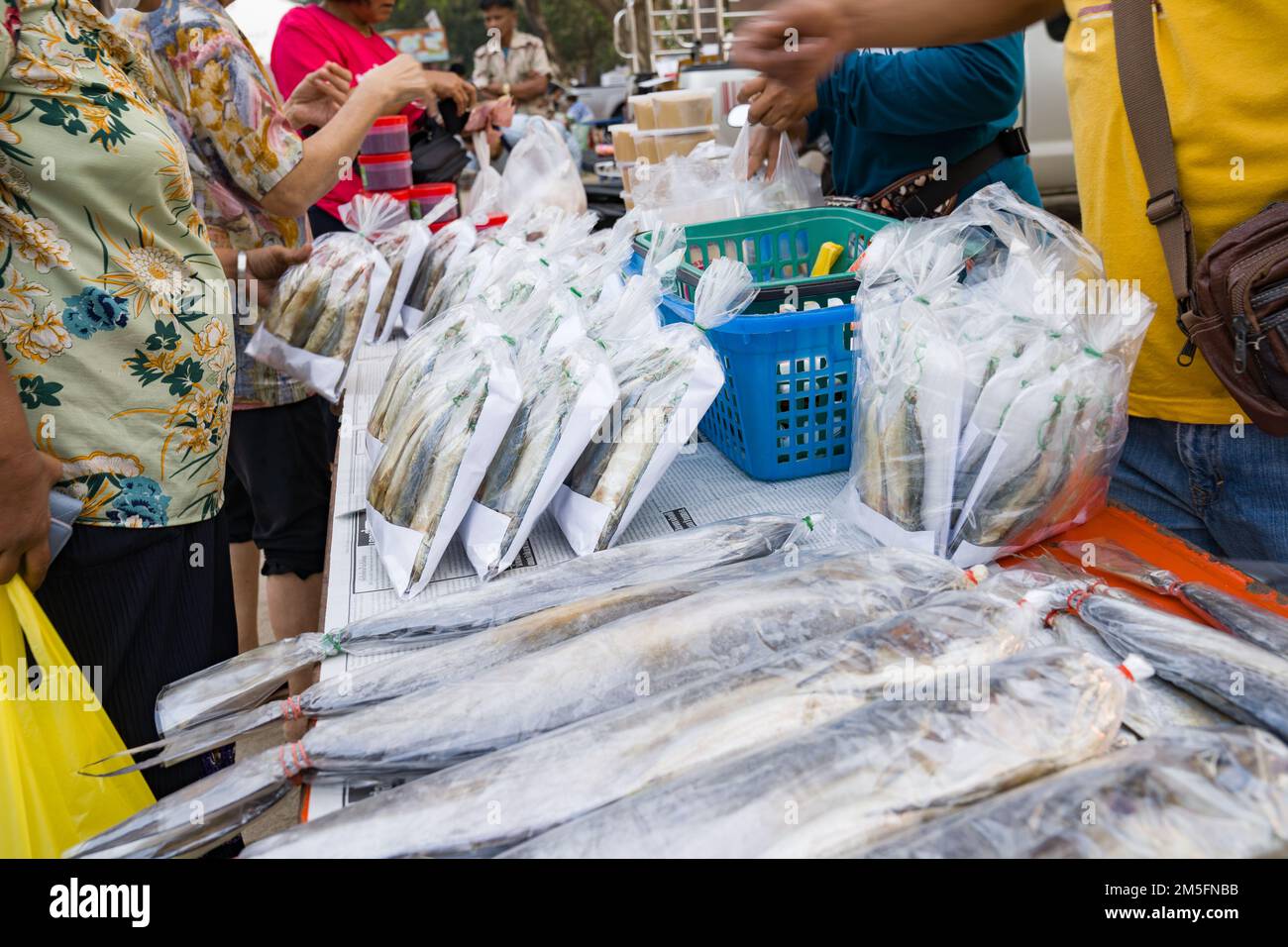 Fresh fish packed in clear bags laying on the table at the local food ...