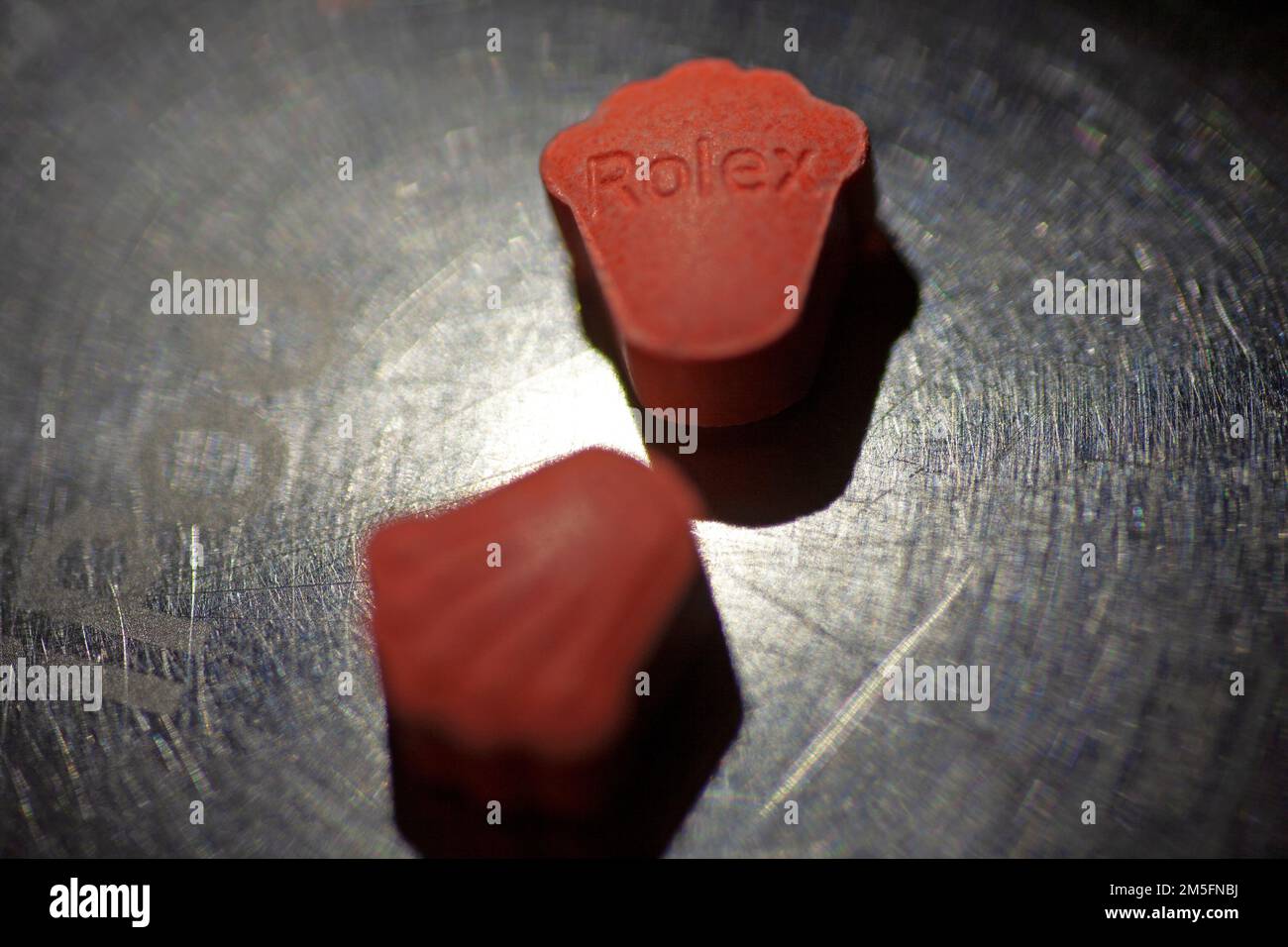 Orange pills with mdma ecstasy dope rolex drug close up background fine ...