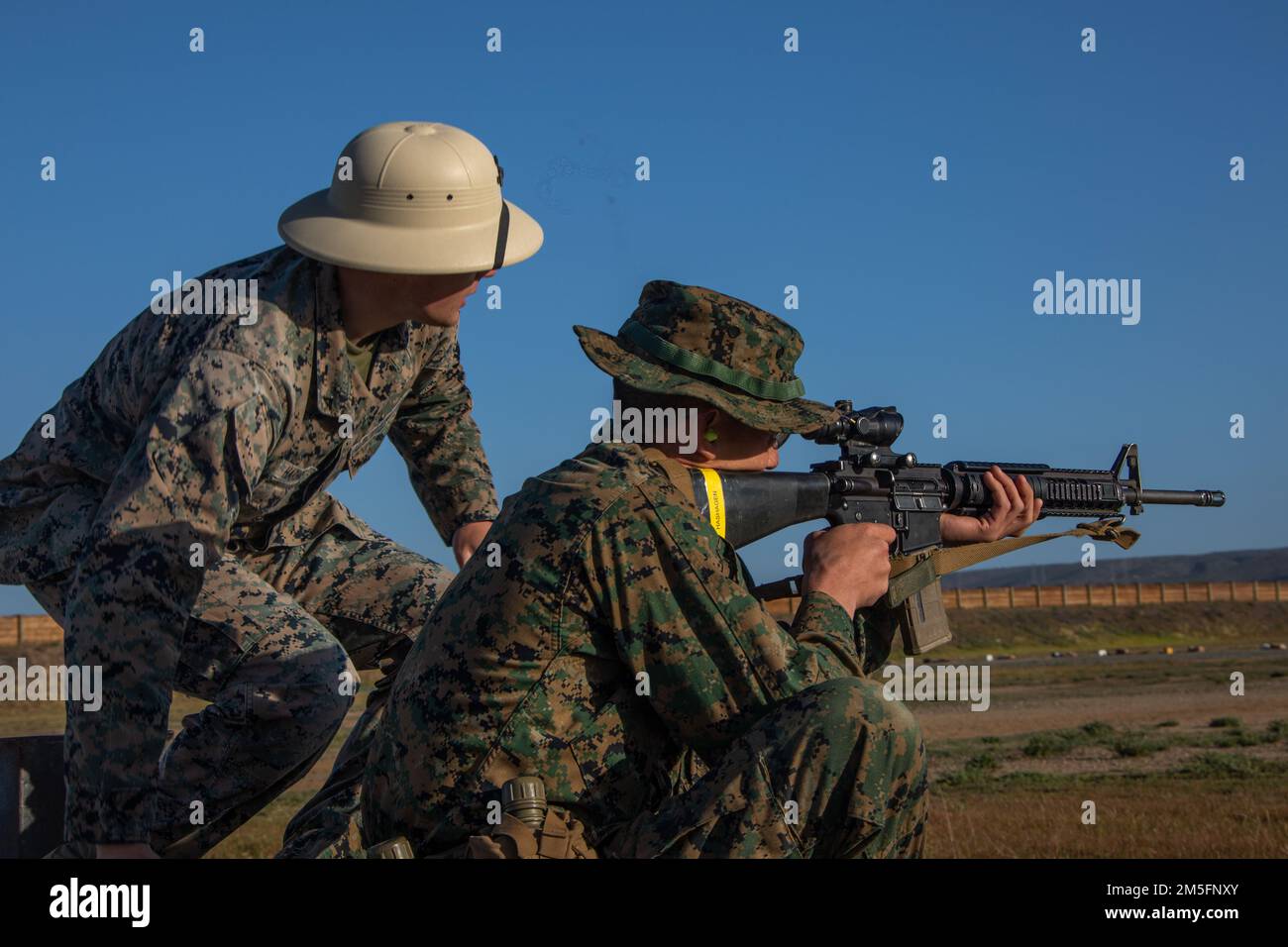 U.S. Marine Corps Lance Cpl. Noah W. Hardage, left, a Marksmanship ...