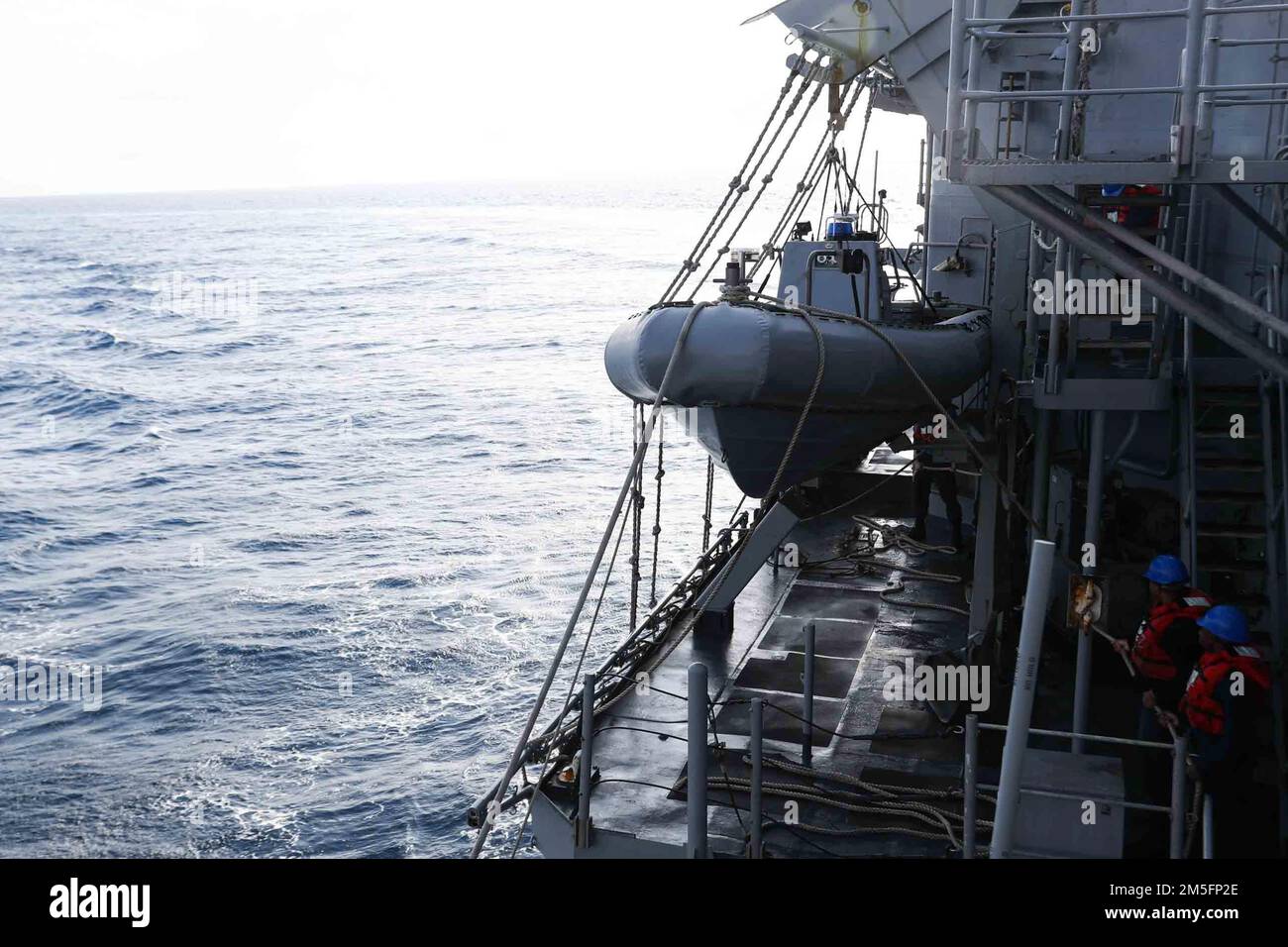 EAST CHINA SEA (March 14, 2022) Sailors prepare a rigid-hull inflatable ...
