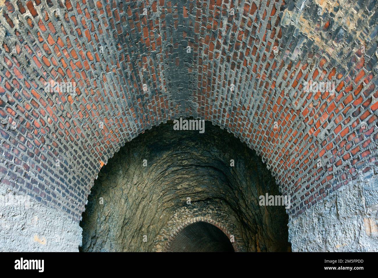 Vaulted brick and mortar arch of old railway tunnel on Central Otago ...