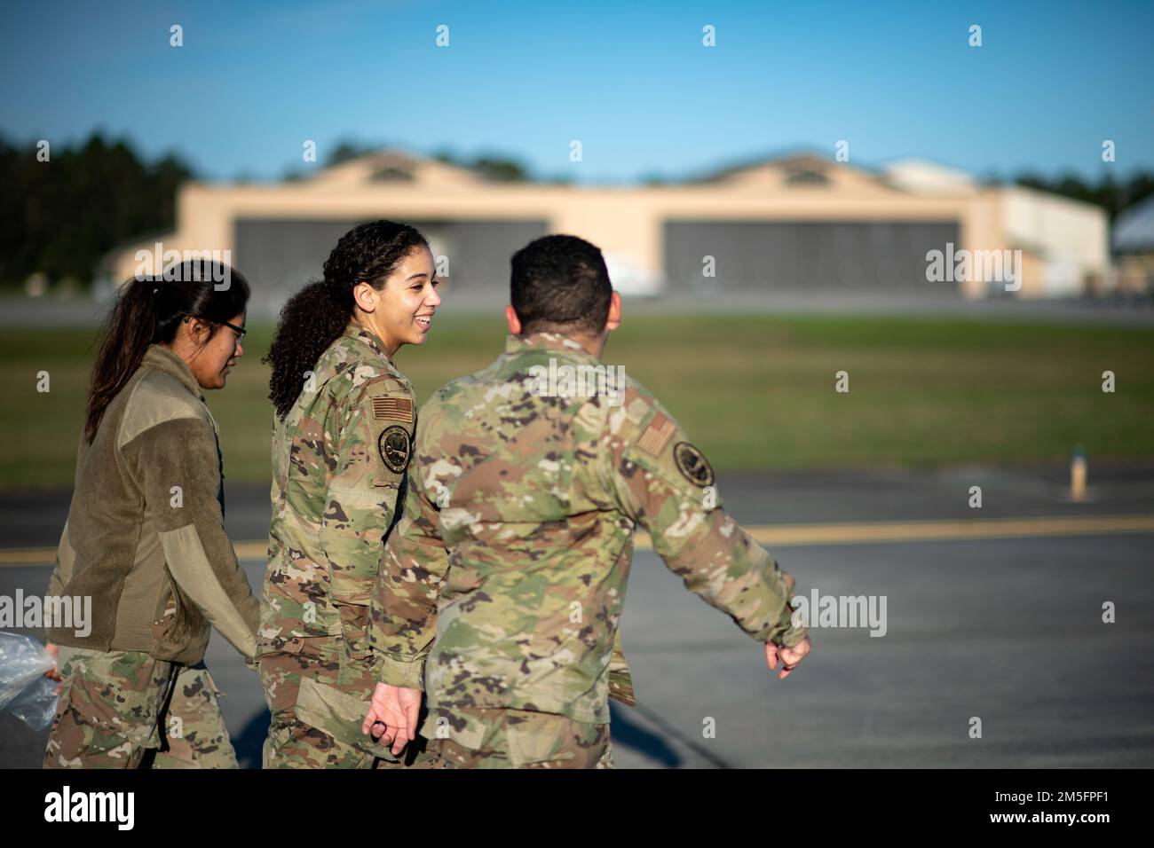 U.S. Air Force Airmen with the 23rd Wing walk off the flightline after ...