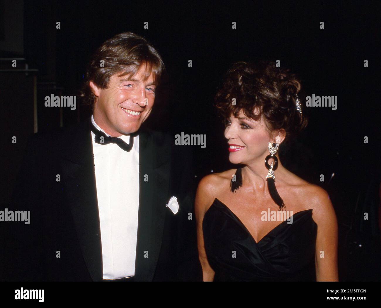 Joan Collins and Bill Wiggins at the 32nd Annual Thalians Ball Honoring Fred MacMurray at ...