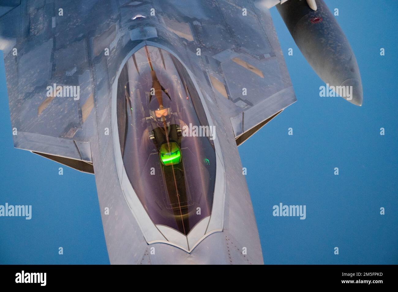 A U.S. Air Force F-22 Raptor receives fuel from a U.S. Air Force KC-135 ...