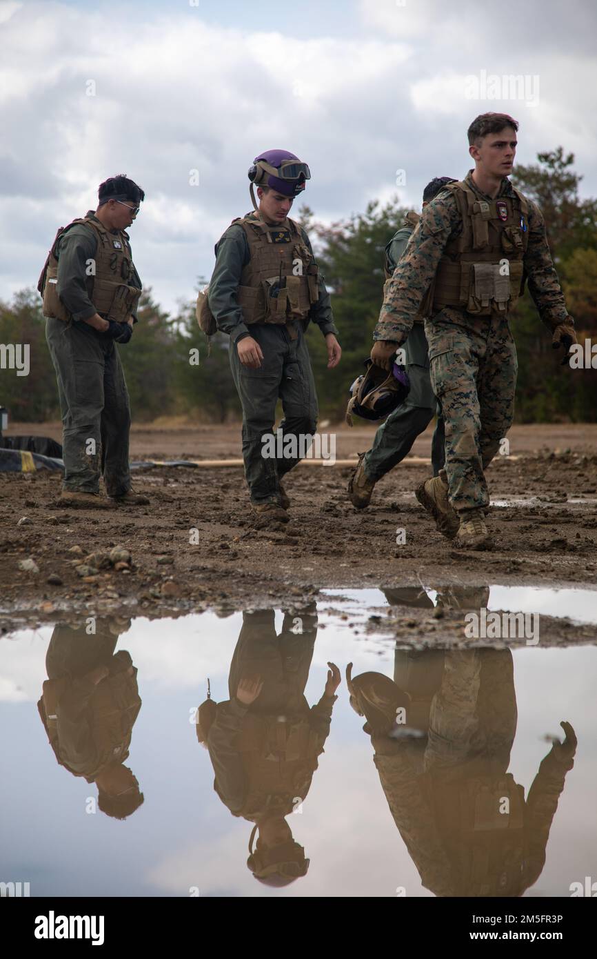 U.S. Marines with Marine Wing Support Squadron (MWSS) 171, walk to a ...