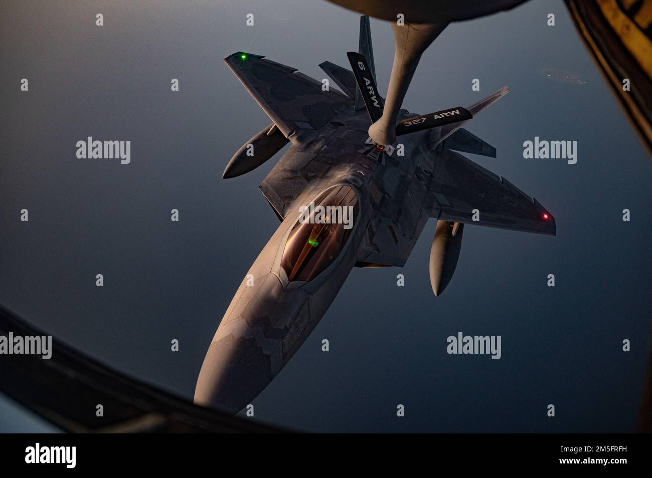 A U.S. Air Force F-22 Raptor receives fuel from a U.S. Air Force KC-135 ...