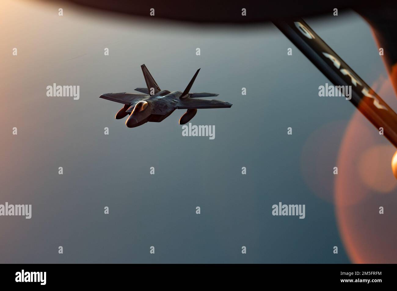 A U.S. Air Force F-22 Raptor flies over the U.S. Central Command area ...
