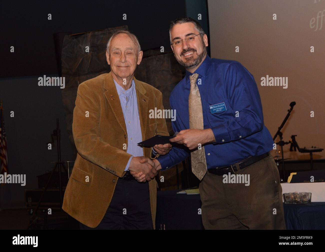 Museum Volunteer David Titus (left) receives a volunteer appreciation ...