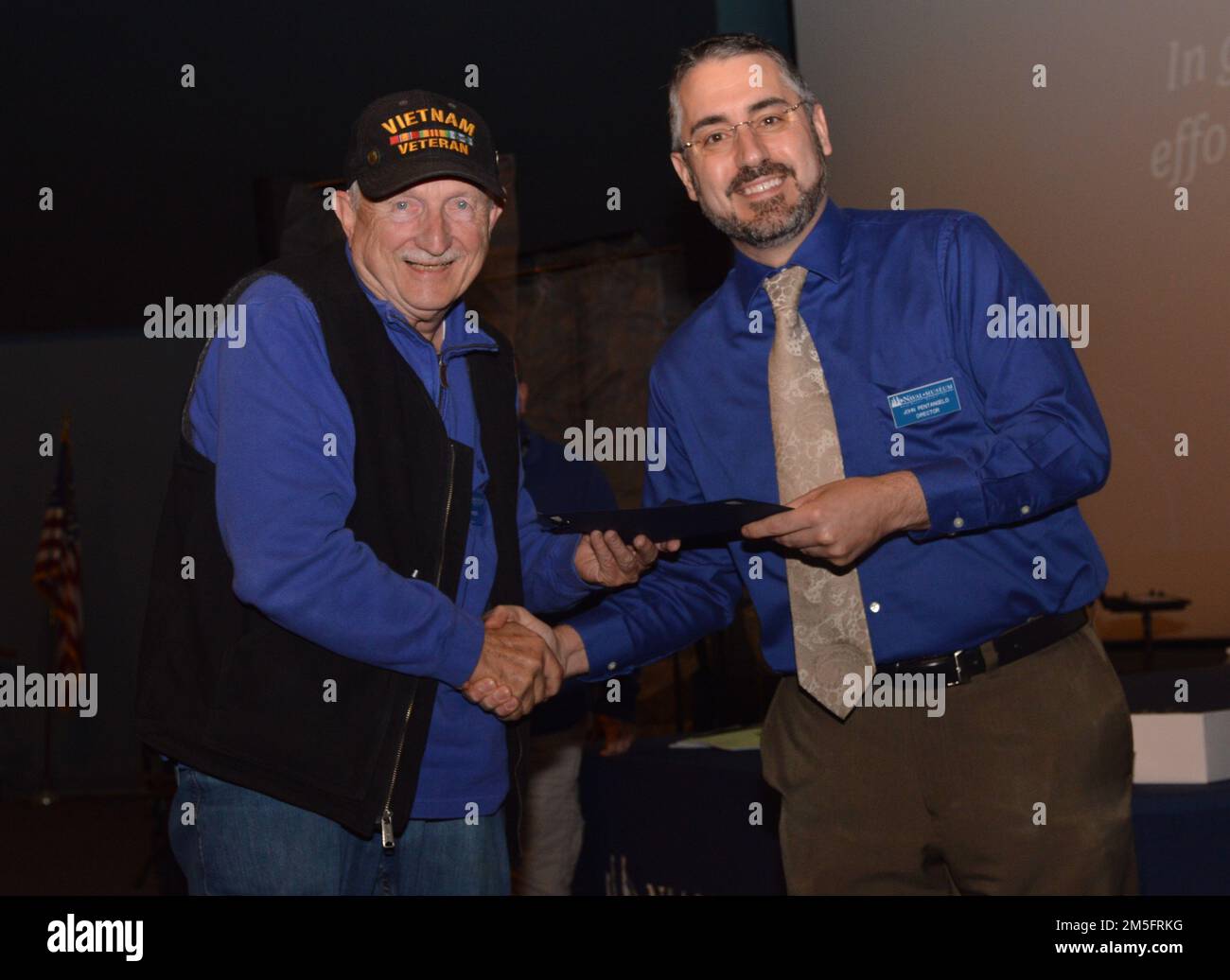 Museum Volunteer Ray Weber (left) receives a volunteer appreciation ...