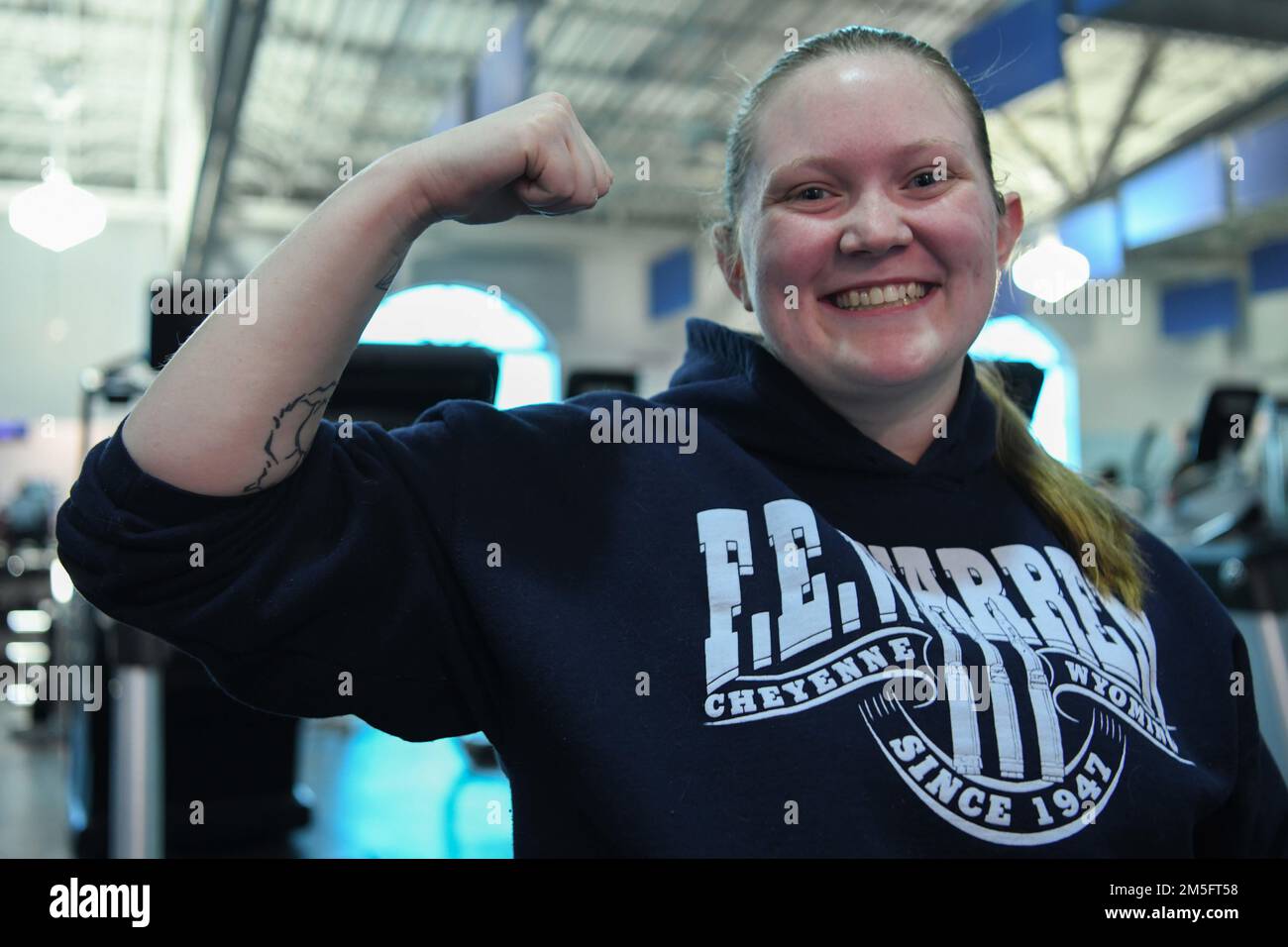 Ashley Nelson, spouse, poses while working out at F.E. Warren Air Force ...