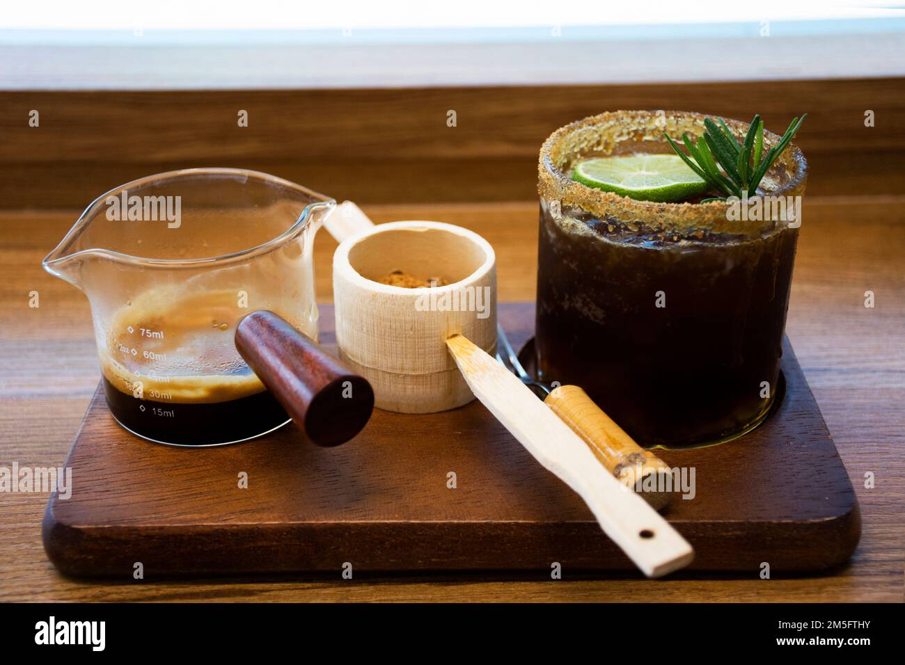 Espresso black coffee serve with brown sugar cane and ice cold lemon ...
