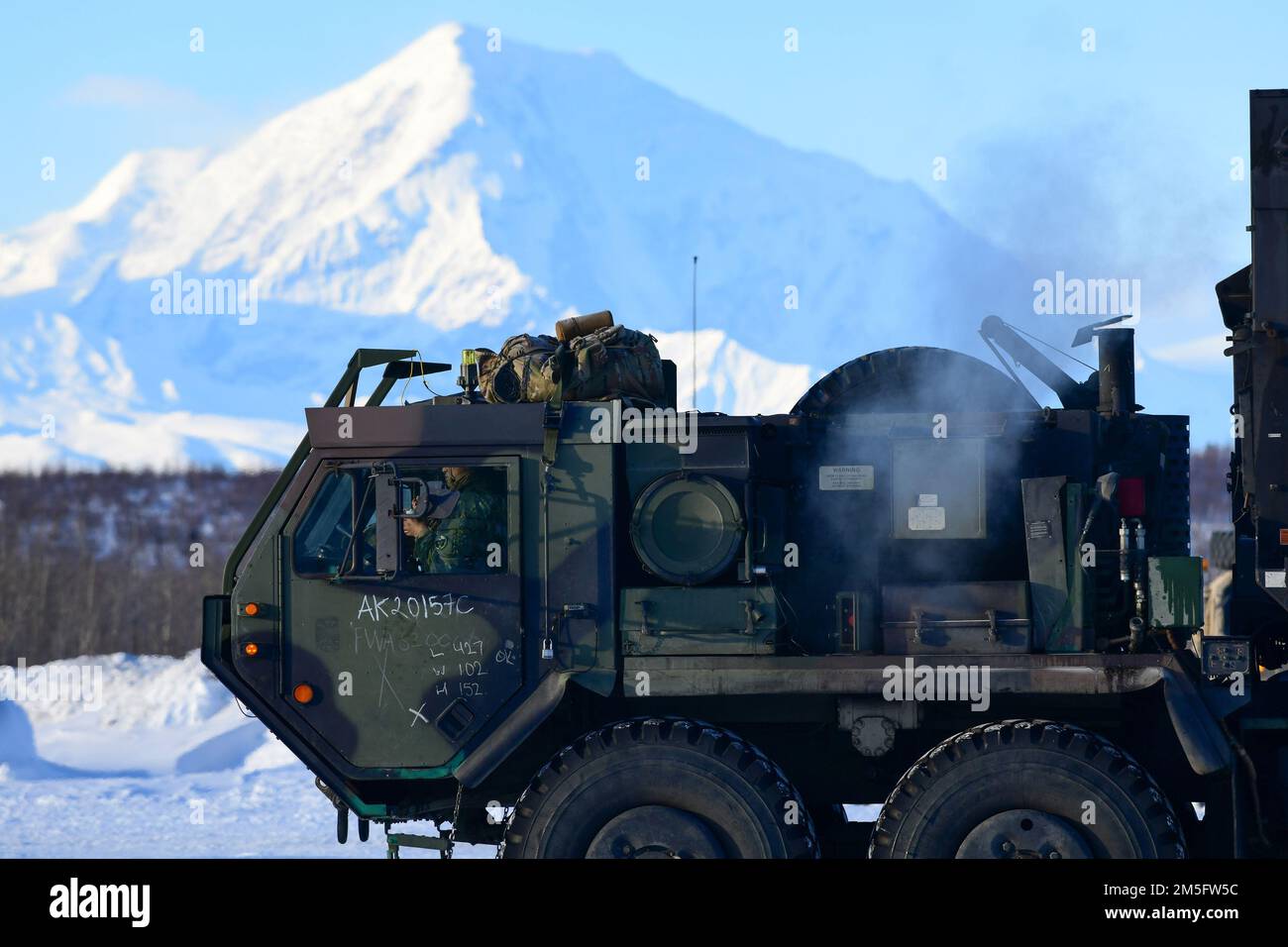 A Heavy Expanded Mobility Tactical Truck waits to take on fuel March 15 ...