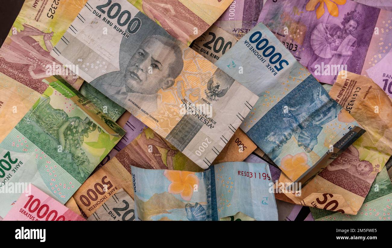 pile of rupiah banknotes as background Stock Photo - Alamy