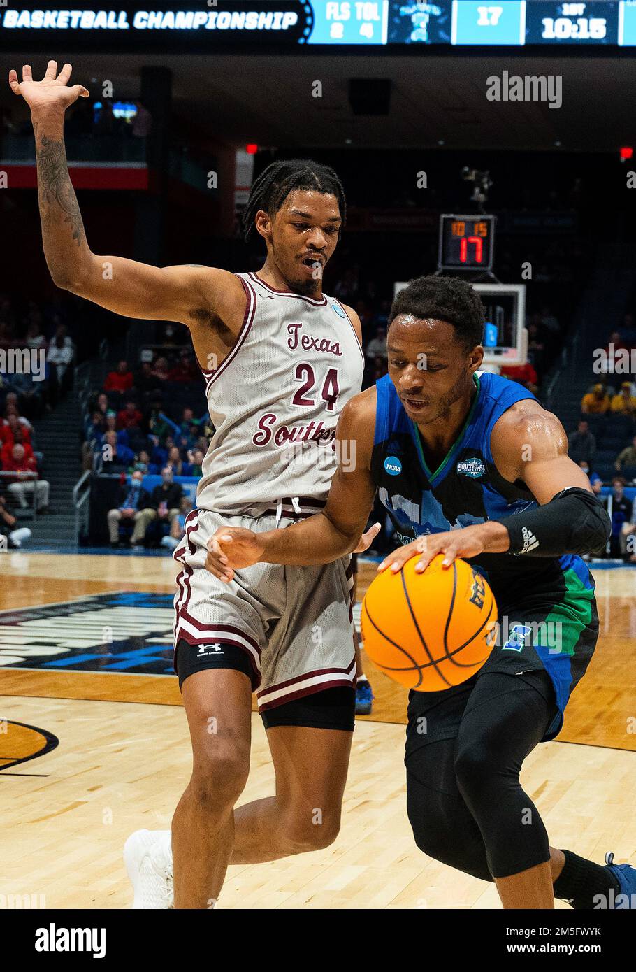 Texas A&M-Corpus Christi’s Isaac Mushila drives past Texas Southern’s ...