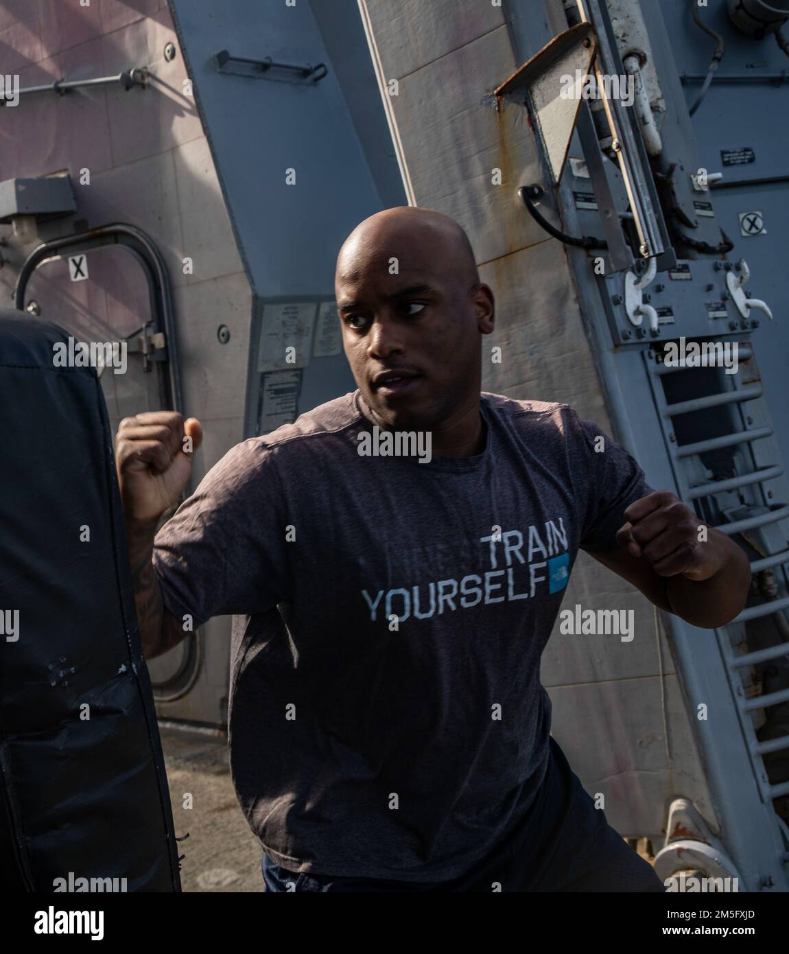 SOUTH CHINA SEA (March 15, 2022) Ensign Treyvon Darby, from Norfolk ...