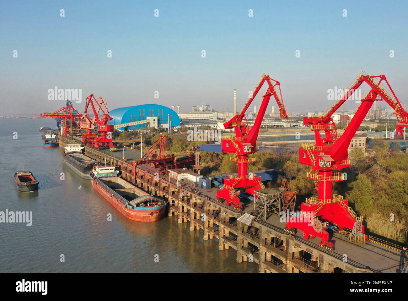 Aerial photo shows the machinery loading and unloading goods and ...