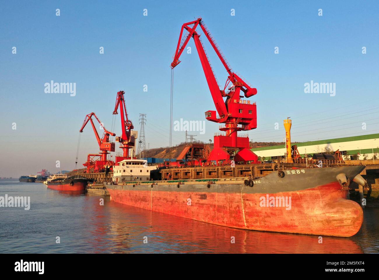 Aerial photo shows the machinery loading and unloading goods and ...