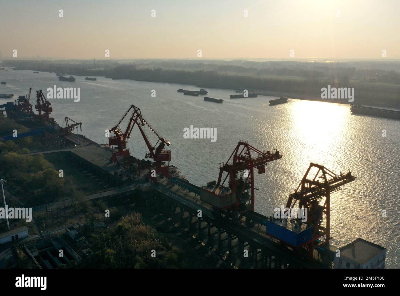 Aerial photo shows the machinery loading and unloading goods and ...