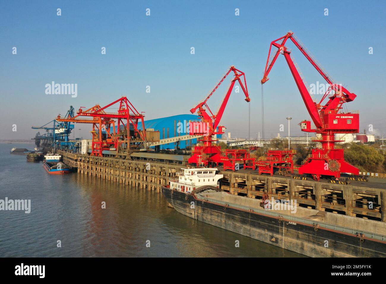 Aerial photo shows the machinery loading and unloading goods and ...