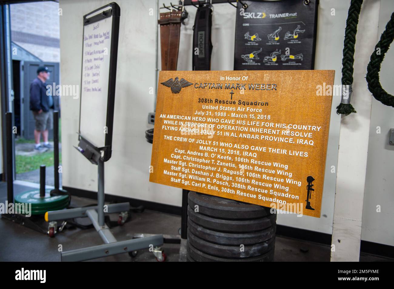 A memorial plaque for U.S. Air Force Capt. Mark Weber, a fallen 38th ...
