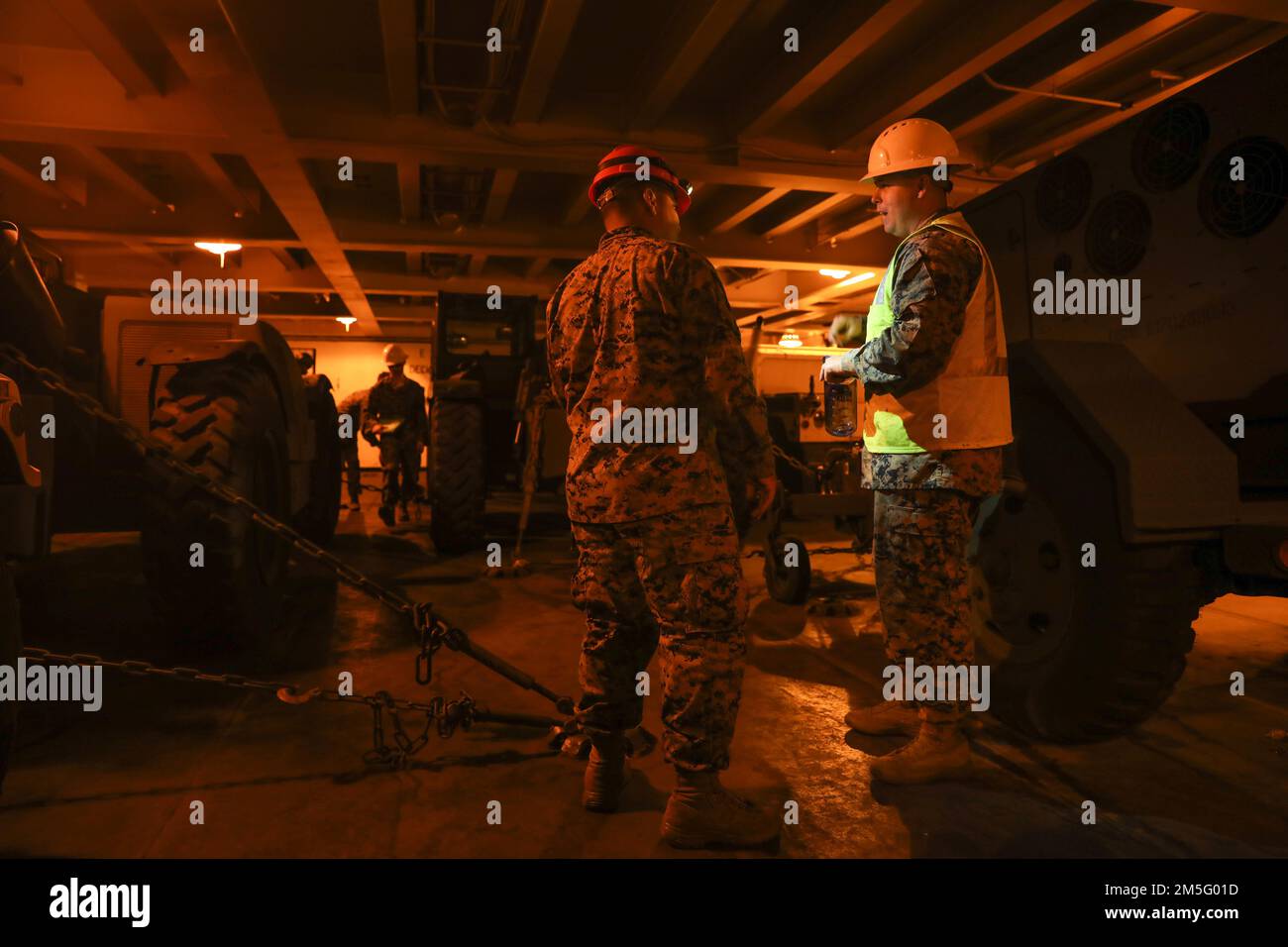U.S. Marine Corps Master Sgt. William Weaver, right, the port ...