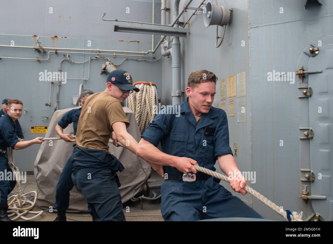 WHITE BEACH, Okinawa (March 15, 2022) Seaman Robert Brandt, right, from ...
