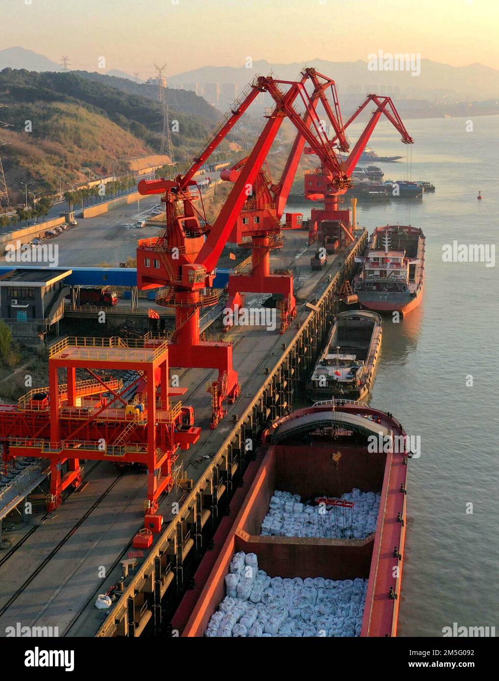 Aerial photo shows the machinery loading and unloading goods and ...