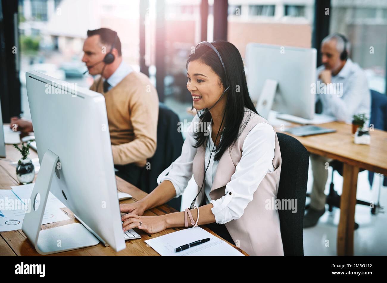 Working at the help desk hi-res stock photography and images - Alamy