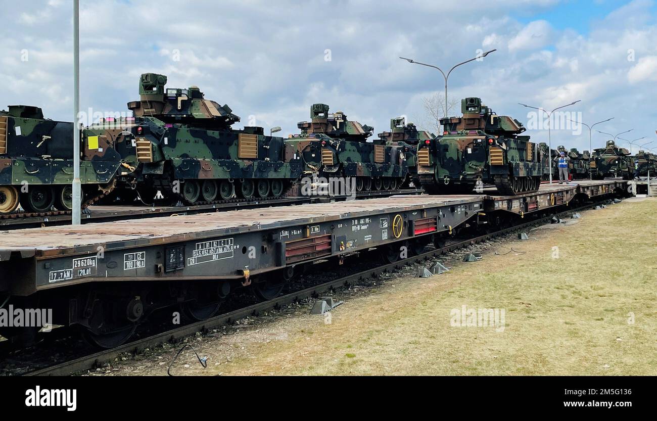 Dozens of M2 Bradley infantry fighting vehicles are loaded onto German ...