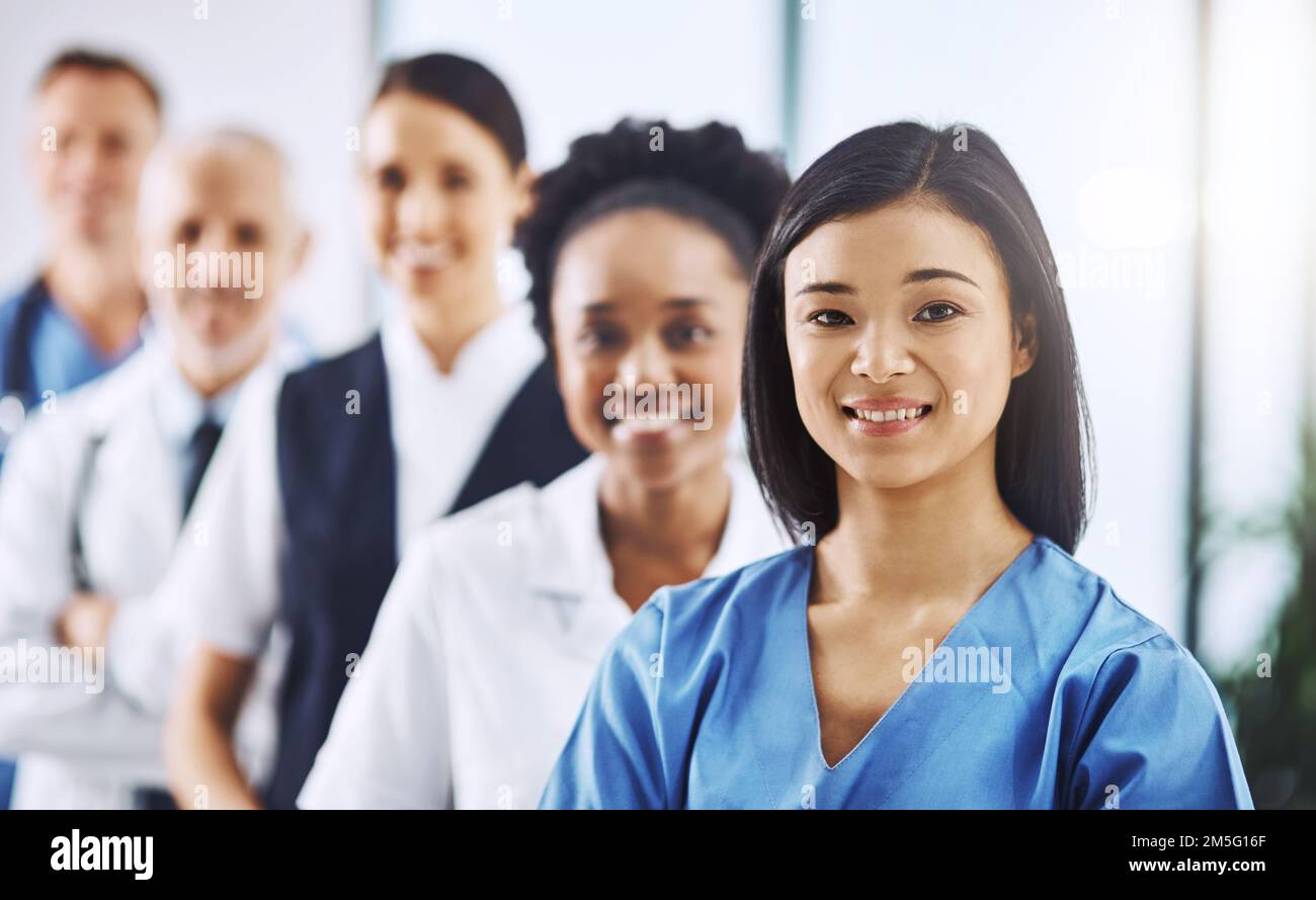 Theyre lining up to help. Cropped portrait of an attractive young female doctor standing at the ...
